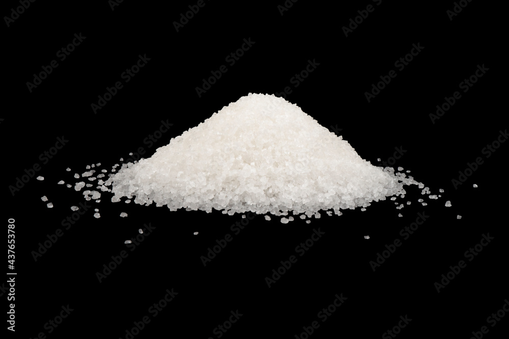Heap of white sugar isolated on a black background. A pile of powdered ...