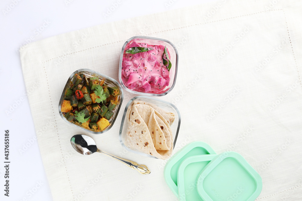 beetroot raitha, chapati, roti, or Indian flatbread with aloo bhindi in ...