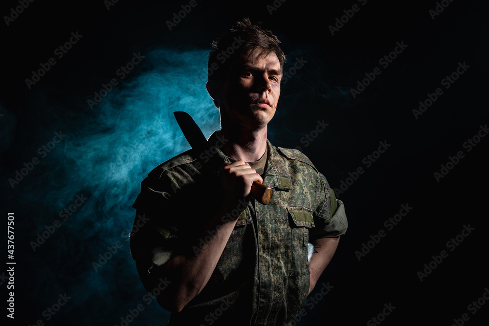 Portrait of a soldier with scars and combat coloring, holding a machete ...
