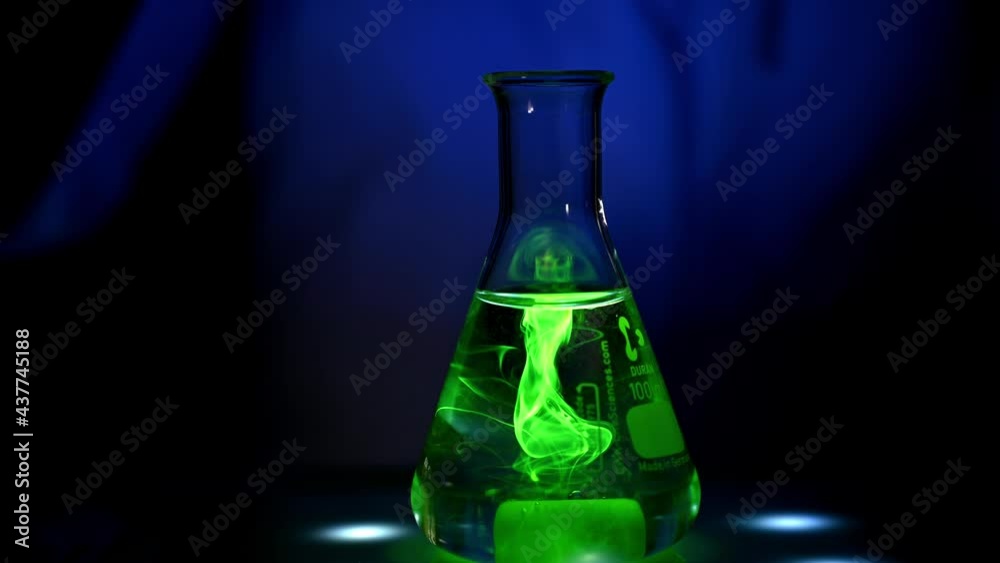 A glowing Science lab for kids with fluorescent green liquid inside of ...
