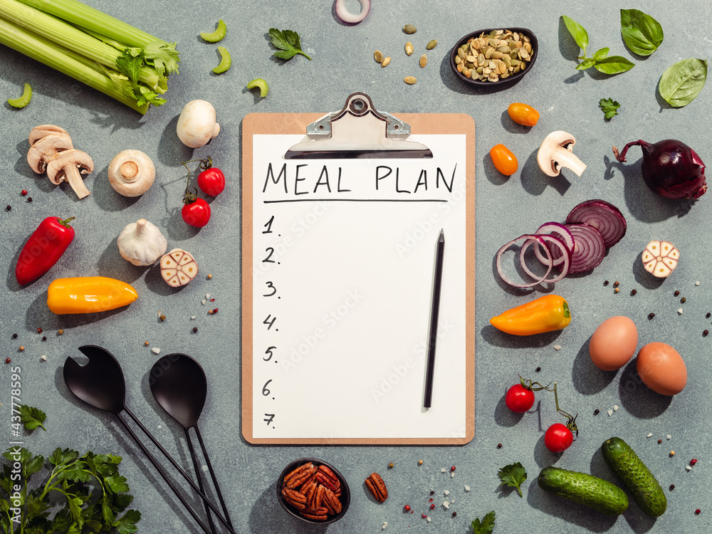 Meal plan concept. Food ingredients, salad serving utensils and ...