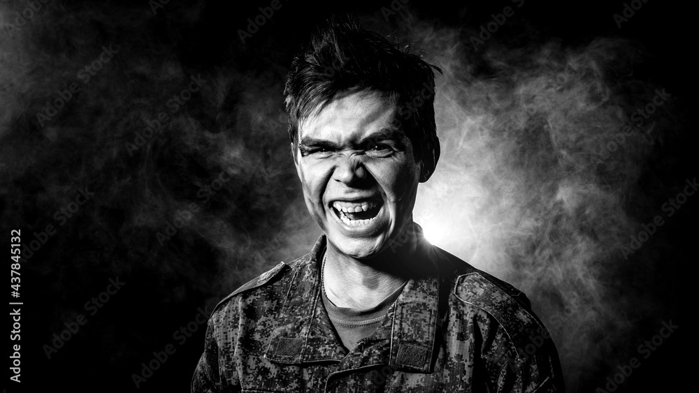 A soldier in military uniform, combat coloring, with scars and bruises ...