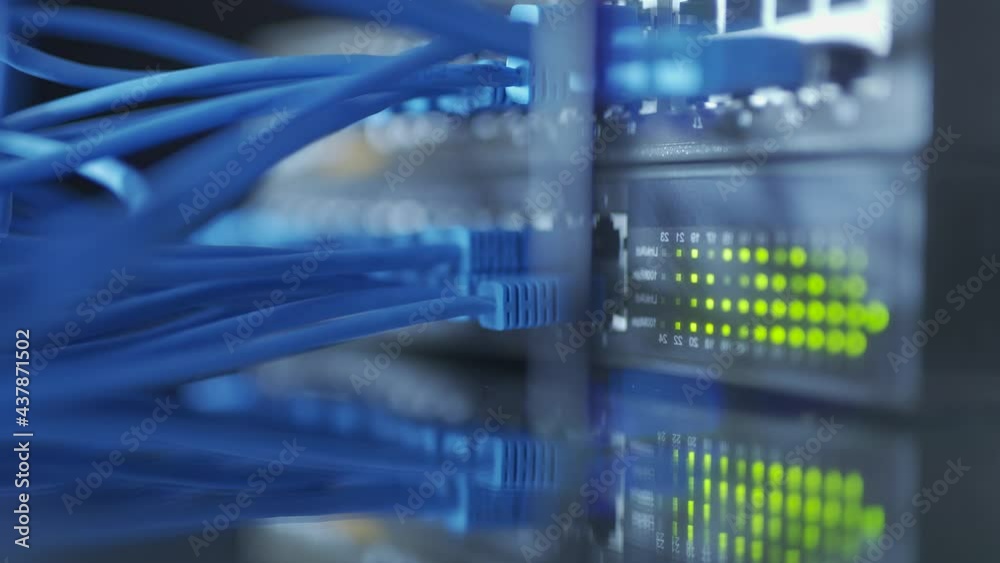 Close up fiber optic in server room. Network cables installed in the ...