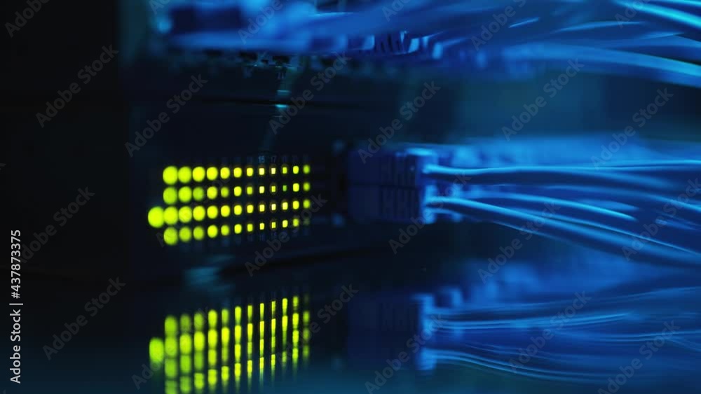 Close up fiber optic in server room. Network cables installed in the ...