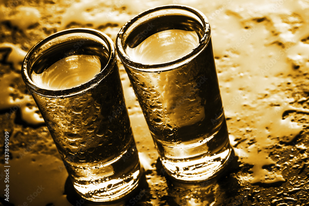 Glass vodka shots. Alcohol drinks in a row texture. Weekend party ...