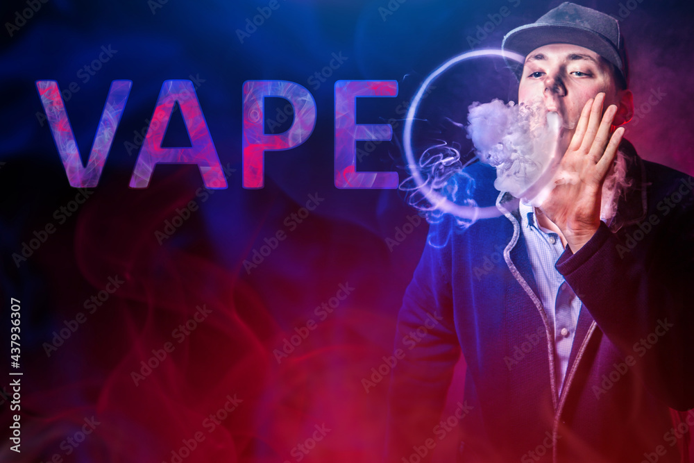 Vape ring in front of a man. He makes a ring from cigarette smoke. Word ...