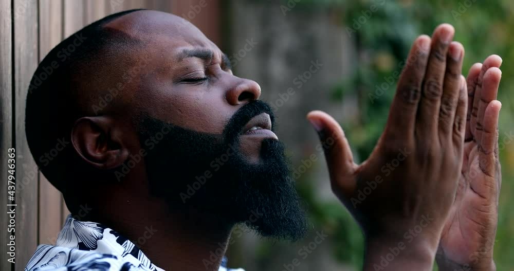 African man praying to God, person asking for divine help, begging for ...
