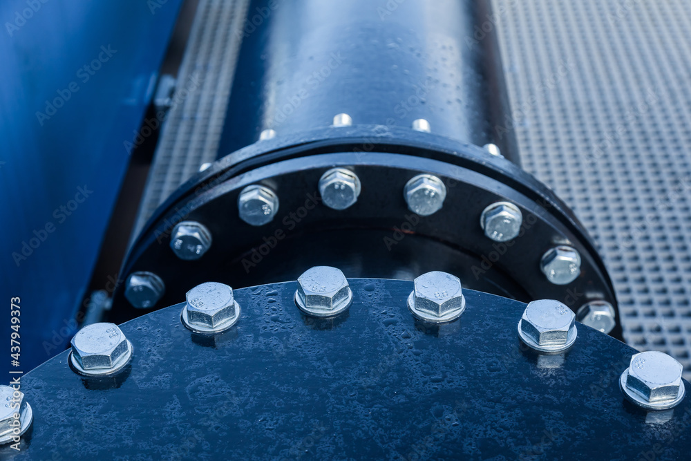 Large pipe connection with a large number of bolts and nuts enclosed on ...