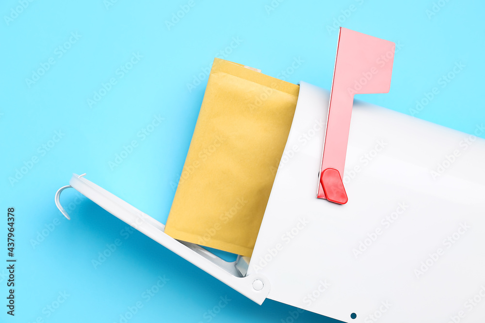 Mail box with letter on color background, closeup Stock Photo | Adobe Stock