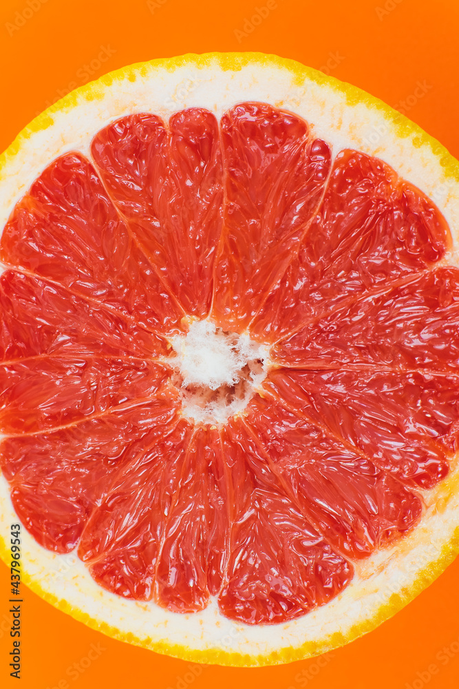 Grapefruit texture inside on the orange background. Citrus close up ...