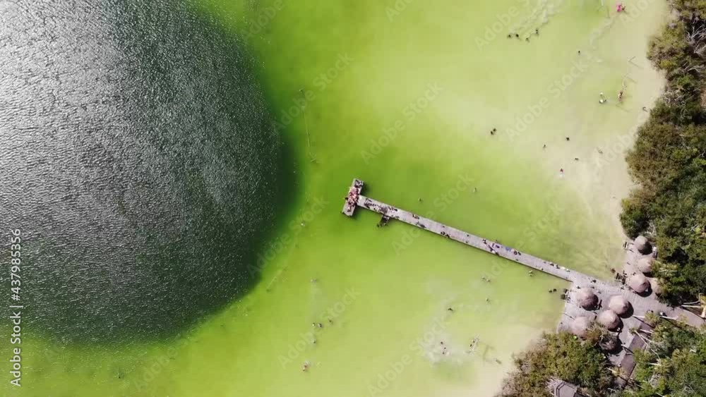 A large lake with a deep cenote inside. Aerial view of Kaan Luum lagoon ...