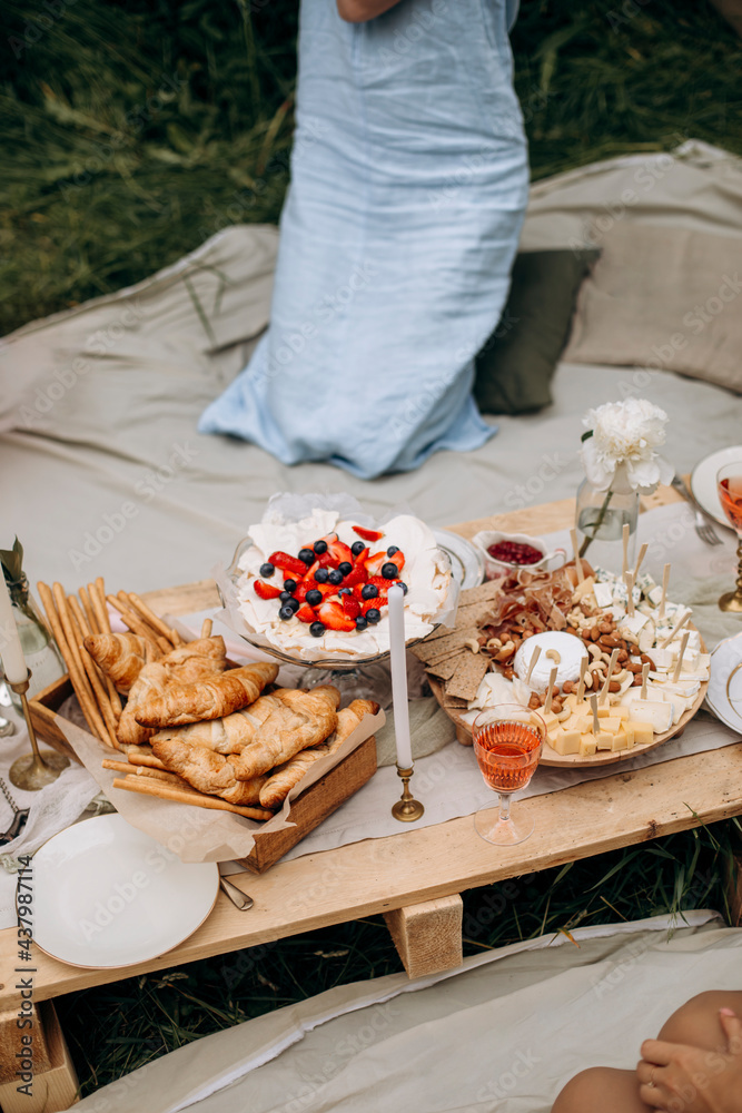 outdoor picnic feast. festive pallet table with desserts and snacks ...