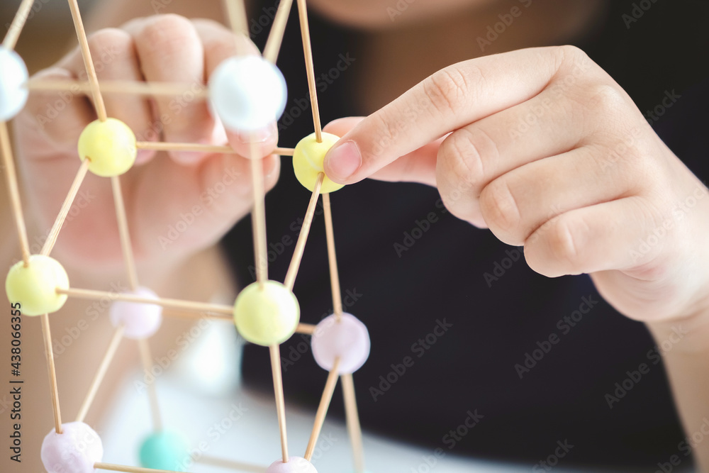 STEM education, Close up hands, child learning making 3D geometric ...