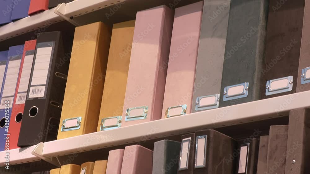 Closeup shot of storage folders for documents in shelves. Different ...