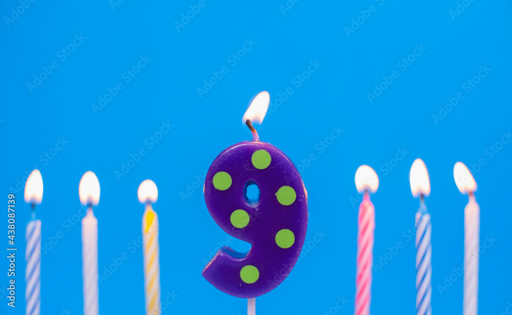 Burning birthday cake candle number 9. Happy Birthday background ...