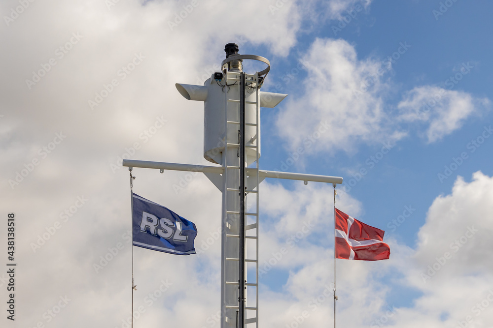 on a ferry there are two different flags, one is the romo flag and the ...