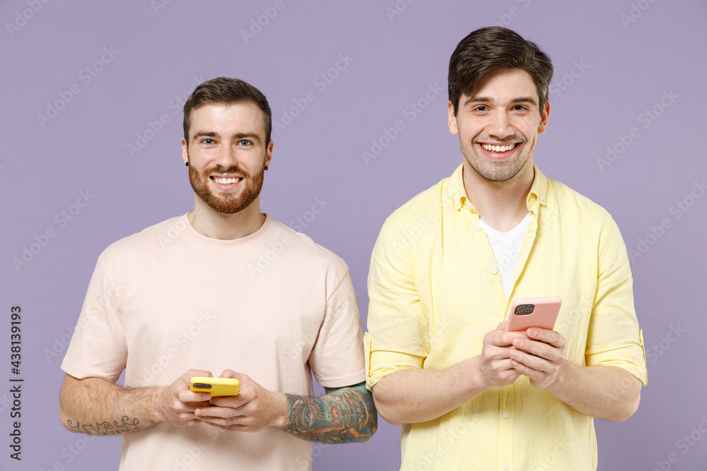 Young smiling cool happy men friends together in casual t-shirt tattoo ...