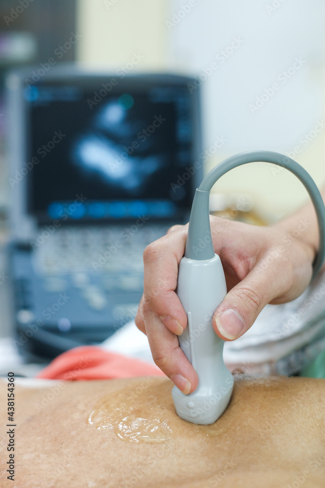 Doctor is examining heart's patient by echocardiogram for diagnosis ...