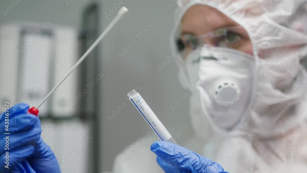 PCR test in laboratory, doctor holding COVID-19 Coronavirus swab ...