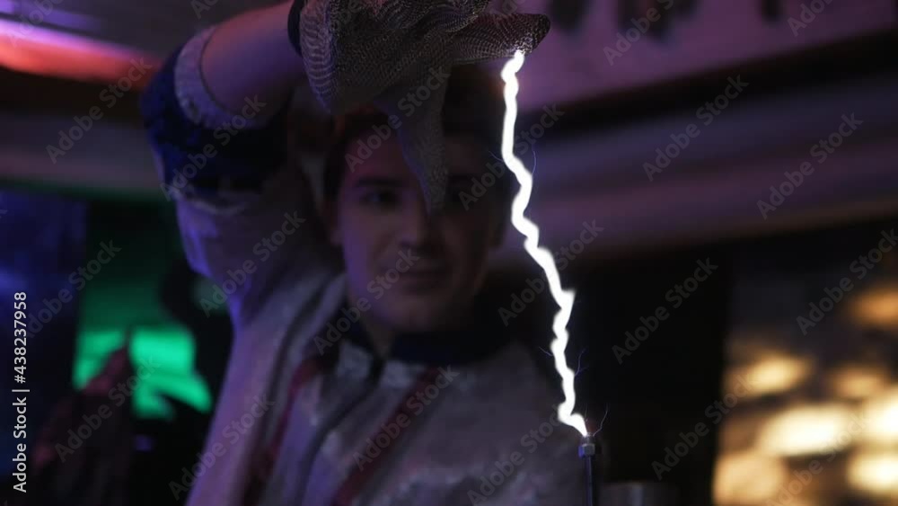 A man plays with lightning. Lord of the current. Tesla mini tower. Of ...