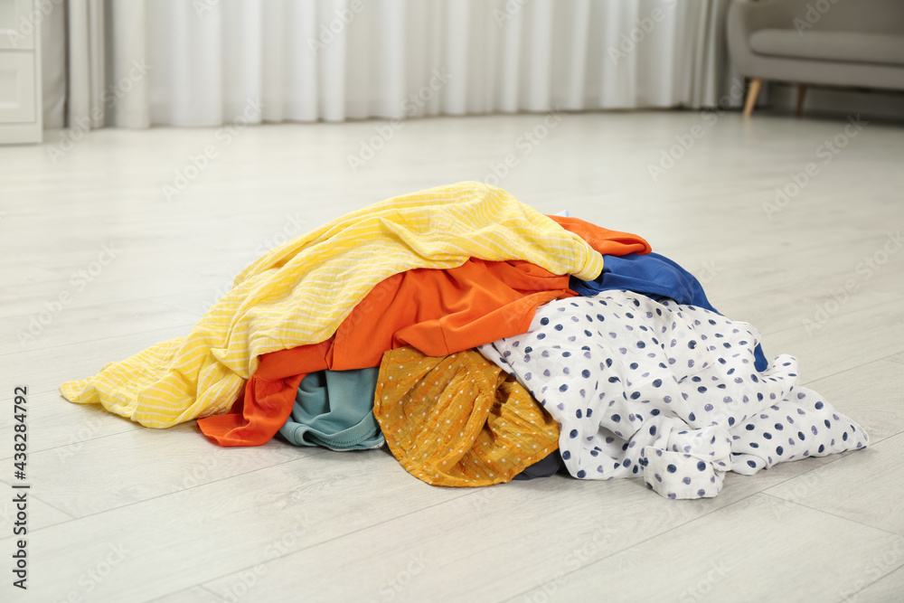 Pile of dirty clothes on floor indoors Stock Photo | Adobe Stock