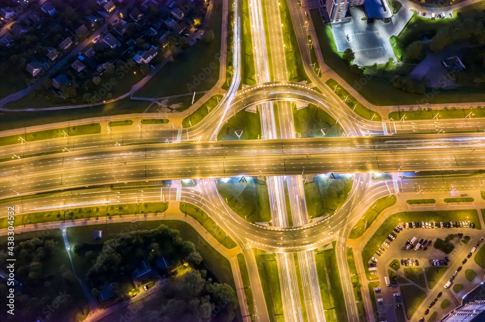 road traffic in night city. aerial view of highway junctions. long ...