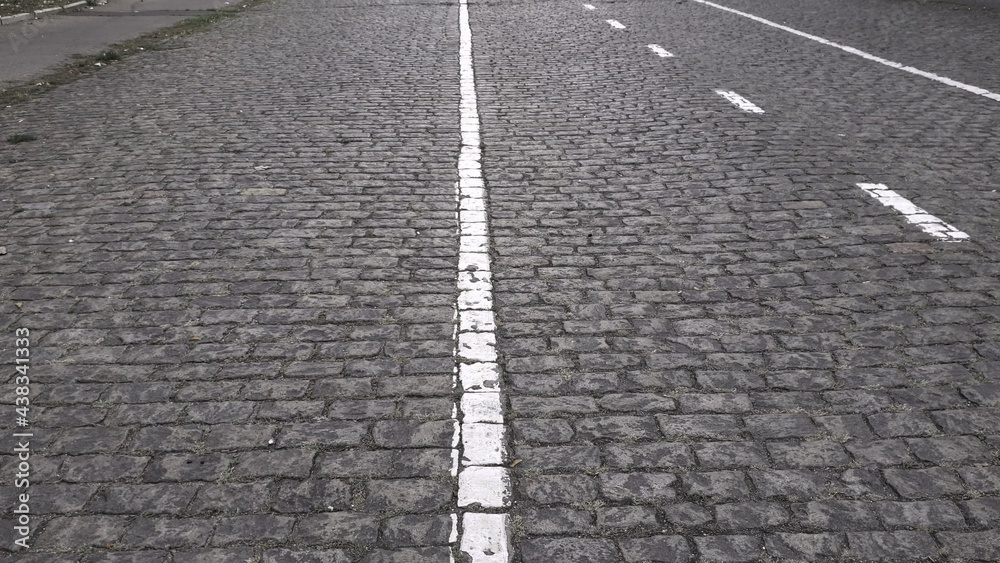 Ancient stone paving road in old town. Cobblestone pavement with ...