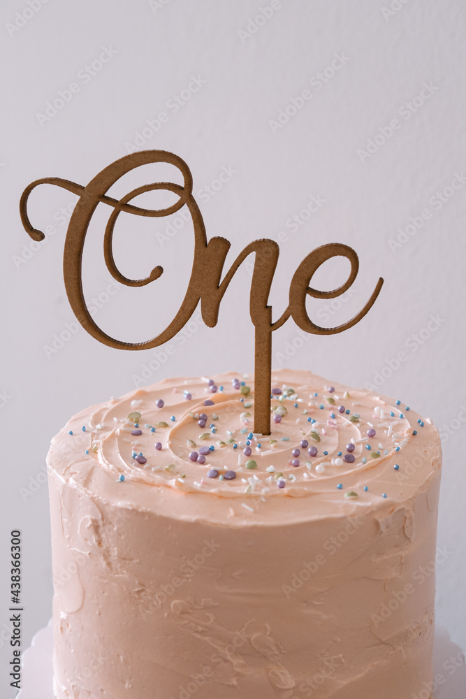 Isolated buttercream soft pink cake for birthday in light grey ...