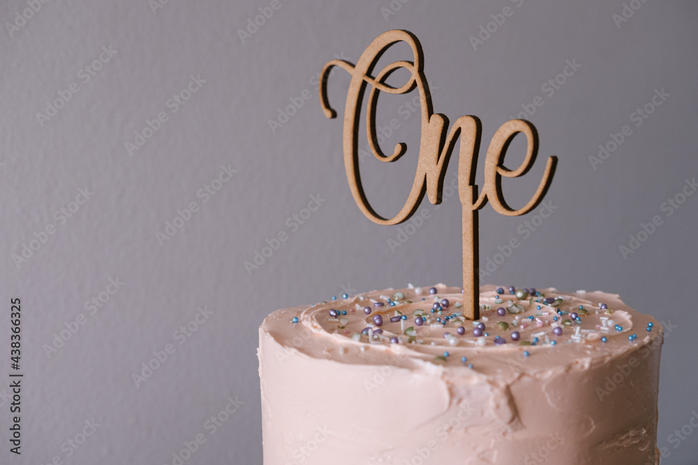 Isolated buttercream soft pink cake for birthday in light grey ...