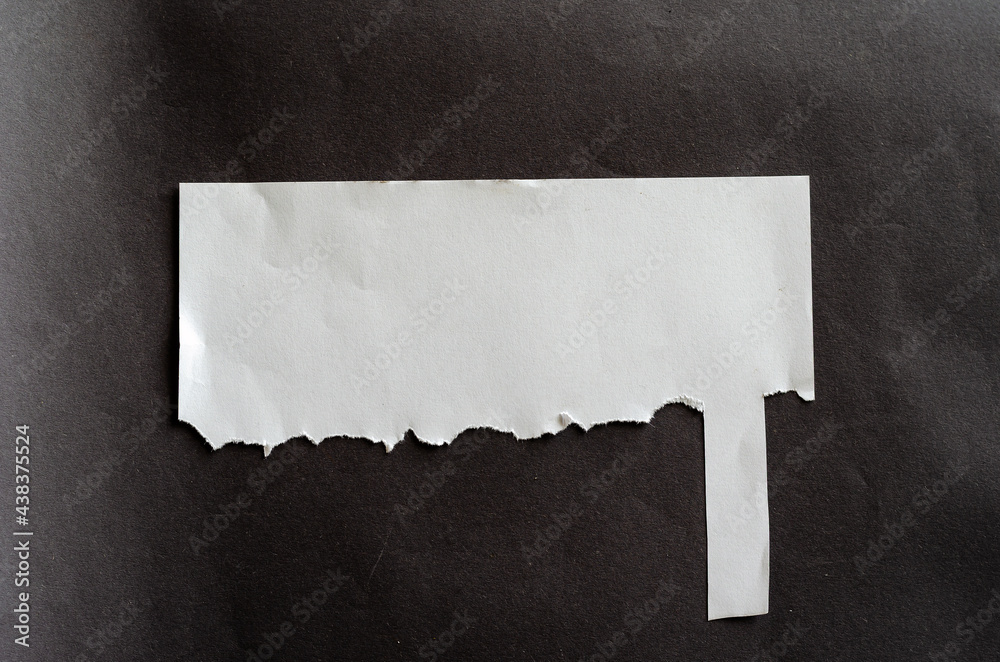 White blank sheet of paper with last tear off tab on gray background ...