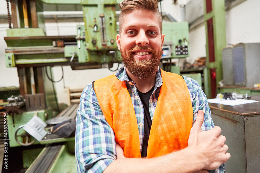 Young man as proud metalworker apprentice Stock Photo | Adobe Stock