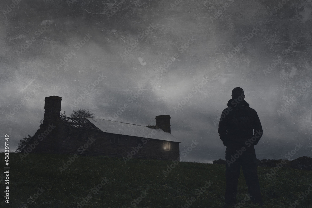 A ruined house in the middle of the countryside. With a light shining ...