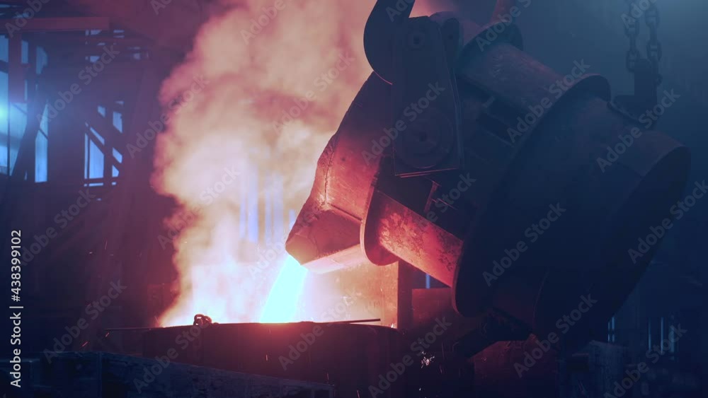 Iron smelting process in foundry furnace in steel mill, metallurgical ...