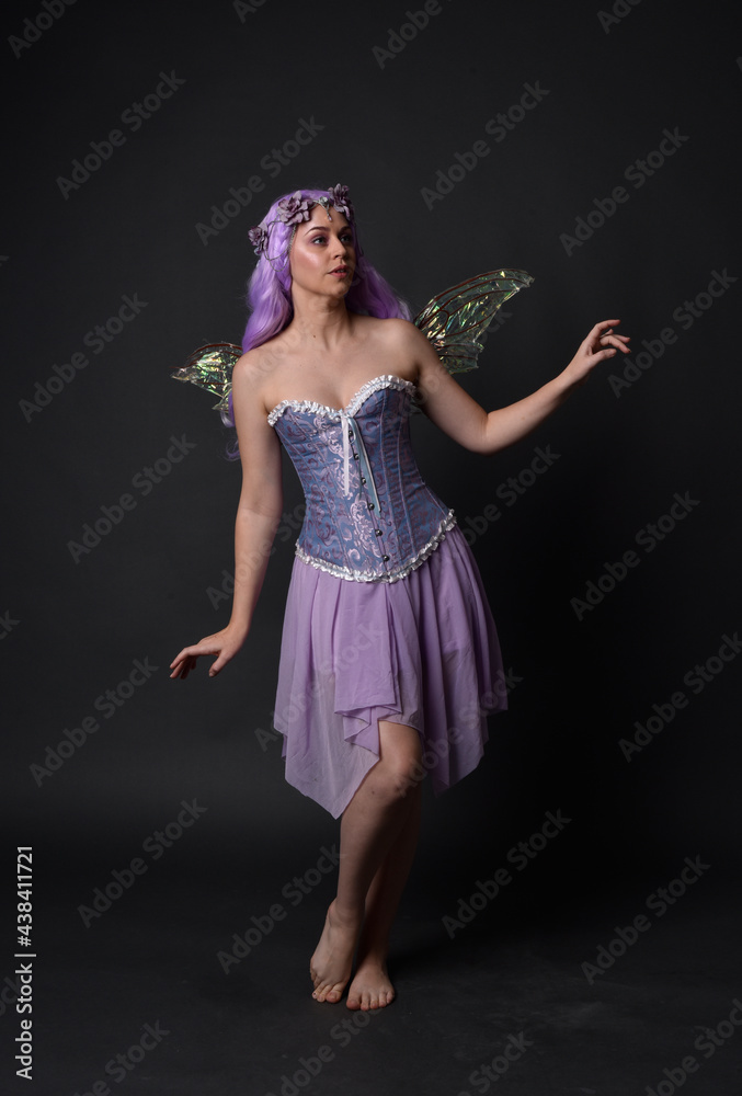 Full length portrait of a purple haired girl wearing fantasy corset ...
