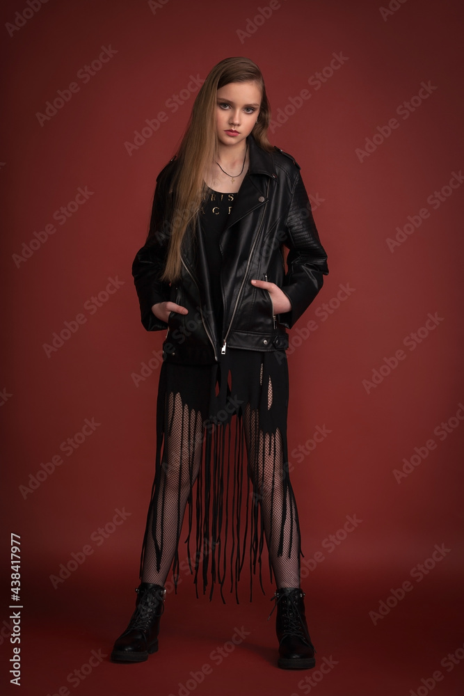 Teen Girl In A Black Dress And Black Leather Jacket Posing In The Teen Girl In A Black Dress And Black Leather Jacket Posing In The
