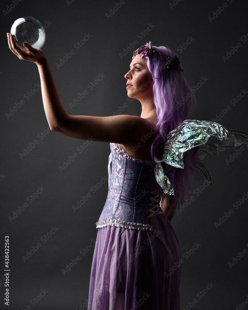 Close up portrait of a purple haired girl wearing fantasy corset dress ...