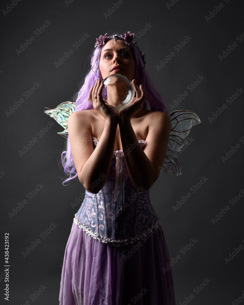 Close up portrait of a purple haired girl wearing fantasy corset dress ...