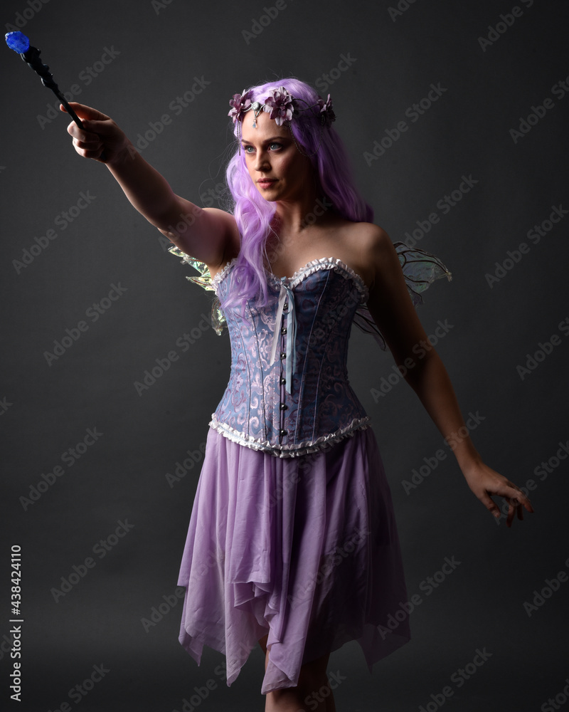 Close up portrait of a purple haired girl wearing fantasy corset dress ...