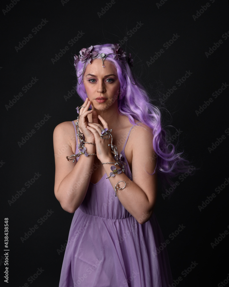 Close up portrait of a purple haired girl wearing fantasy corset dress ...