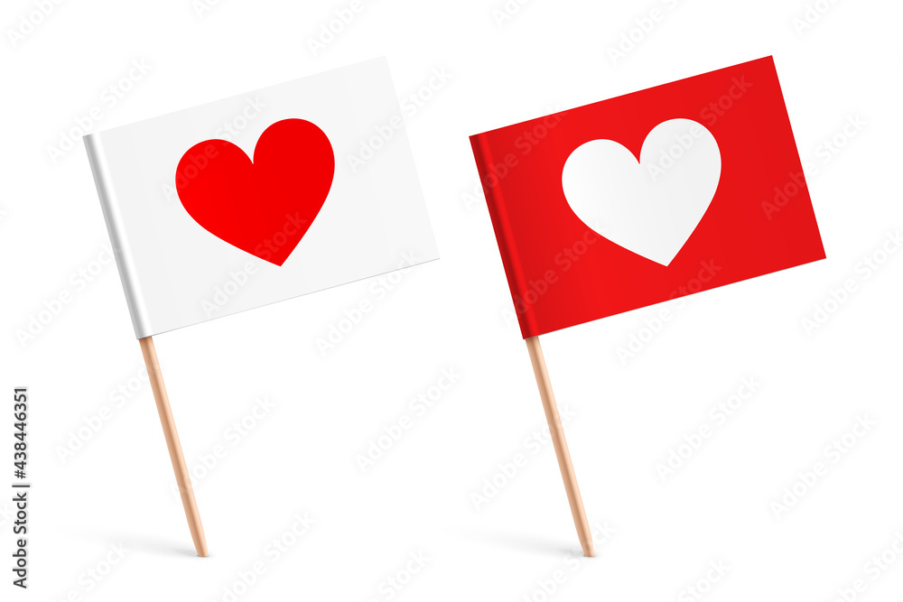Red and white little paper flags with heart icons, sticked on a surface ...