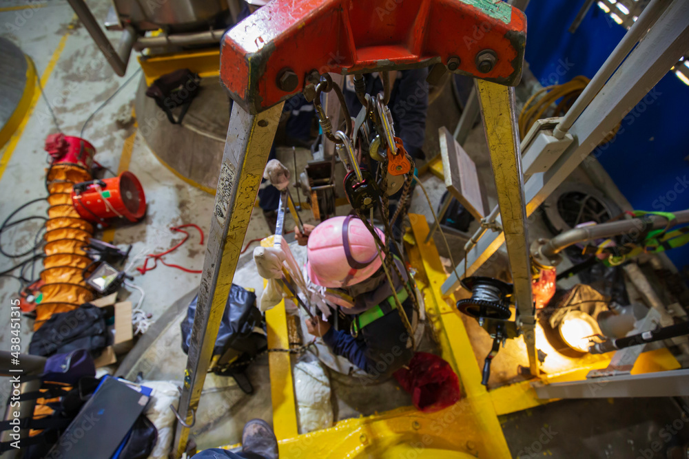 Top view male climb up the stairs into the tank stainless chemical area ...