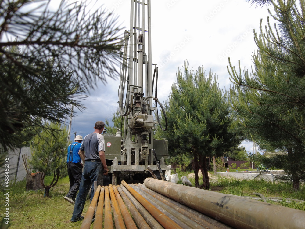 Europe, Kiev region, Ukraine - June 2021: An engineer is drilling a ...