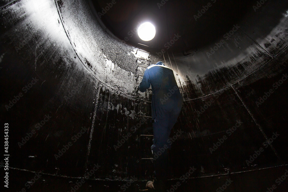 Male inside climb the stairway storage visual inspection tank Stock ...