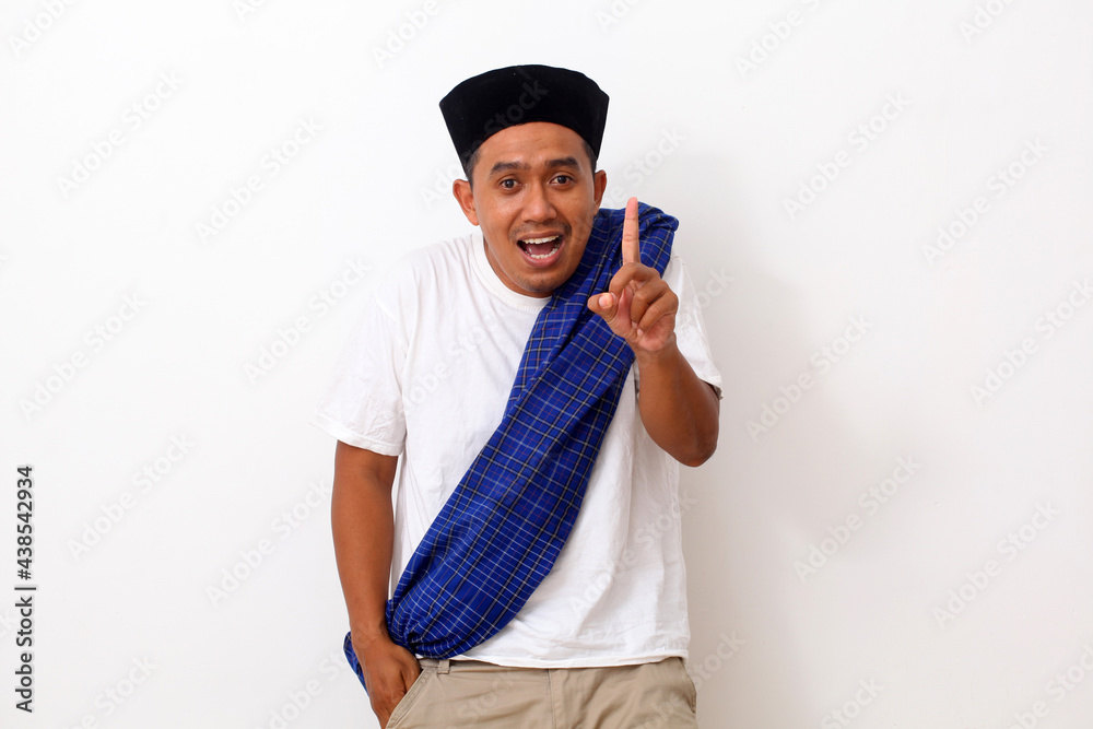 Portrait of Asian man standing and showing one finger. Isolated on ...