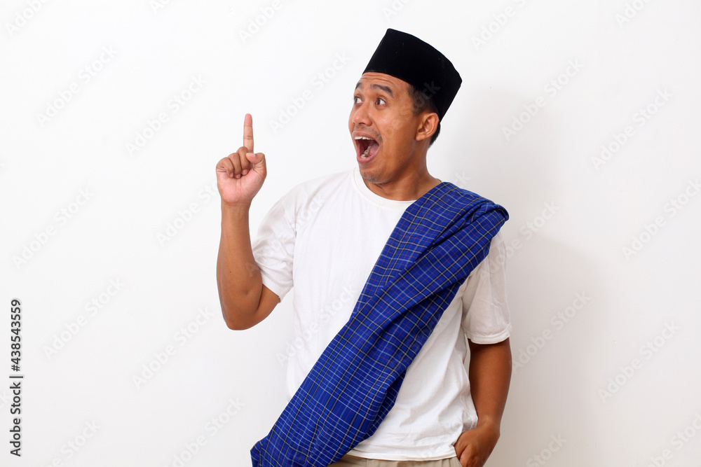 Portrait surprised asian man while standing and presenting something ...
