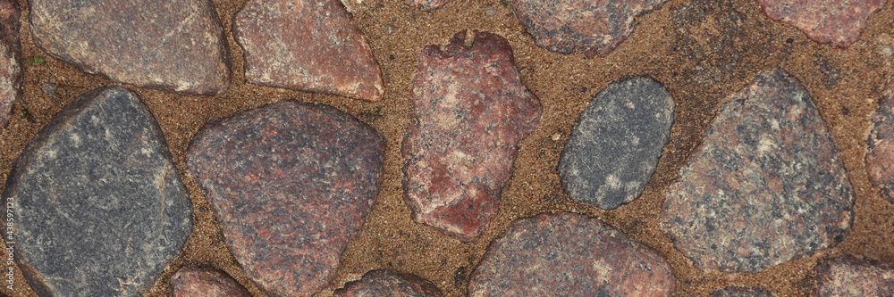 Ground texture with large stones. Old pavement of granite boulders ...