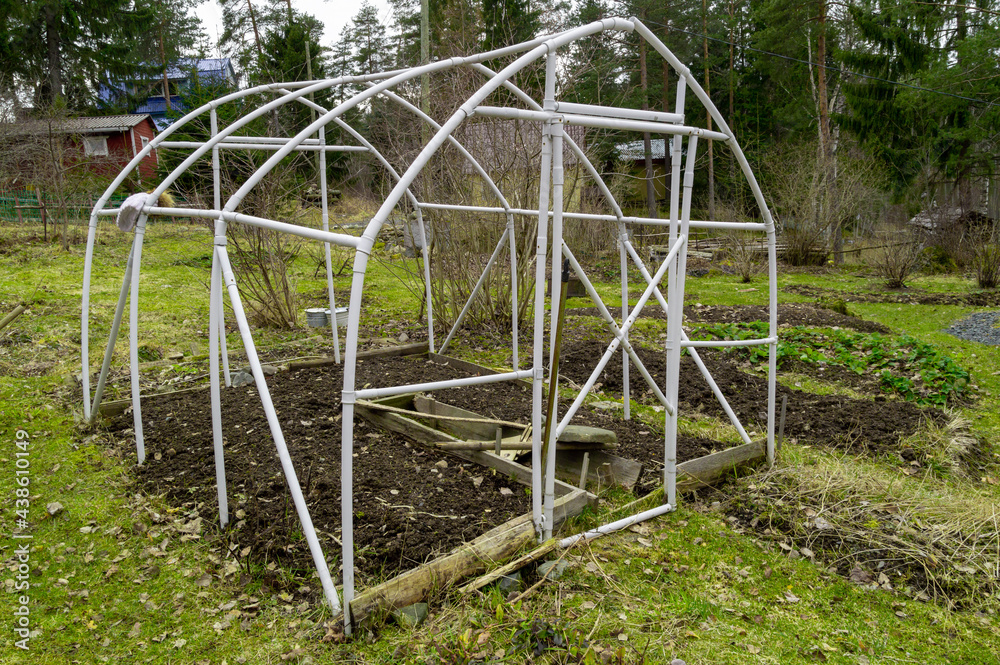 greenhouse frame on a garden plot Stock Photo | Adobe Stock