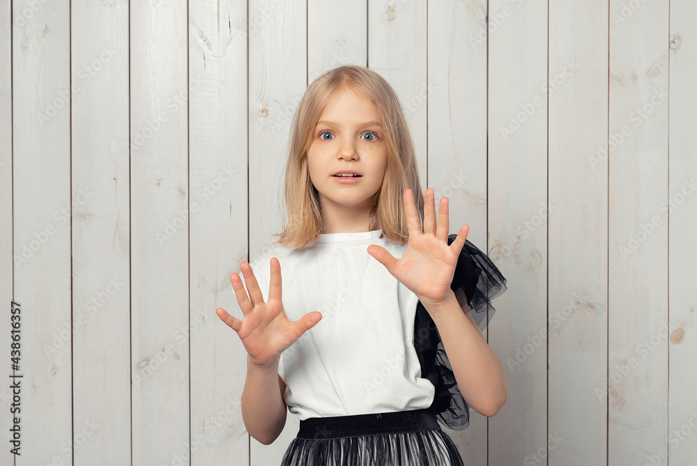 Worried and concerned blonde teen girl looking with frightened ...