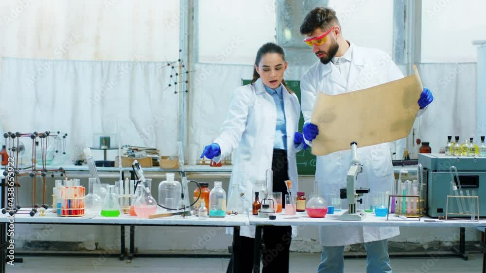 Retro biochemistry laboratory woman s scientist and her assistant ...