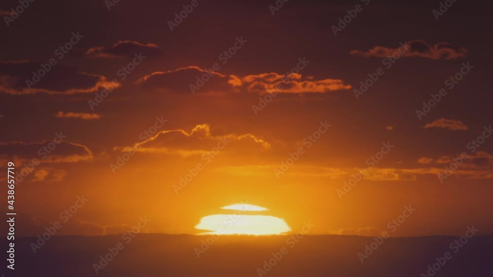 African sunset time lapse with big sun and backlit clouds. Cinematic 4k ...